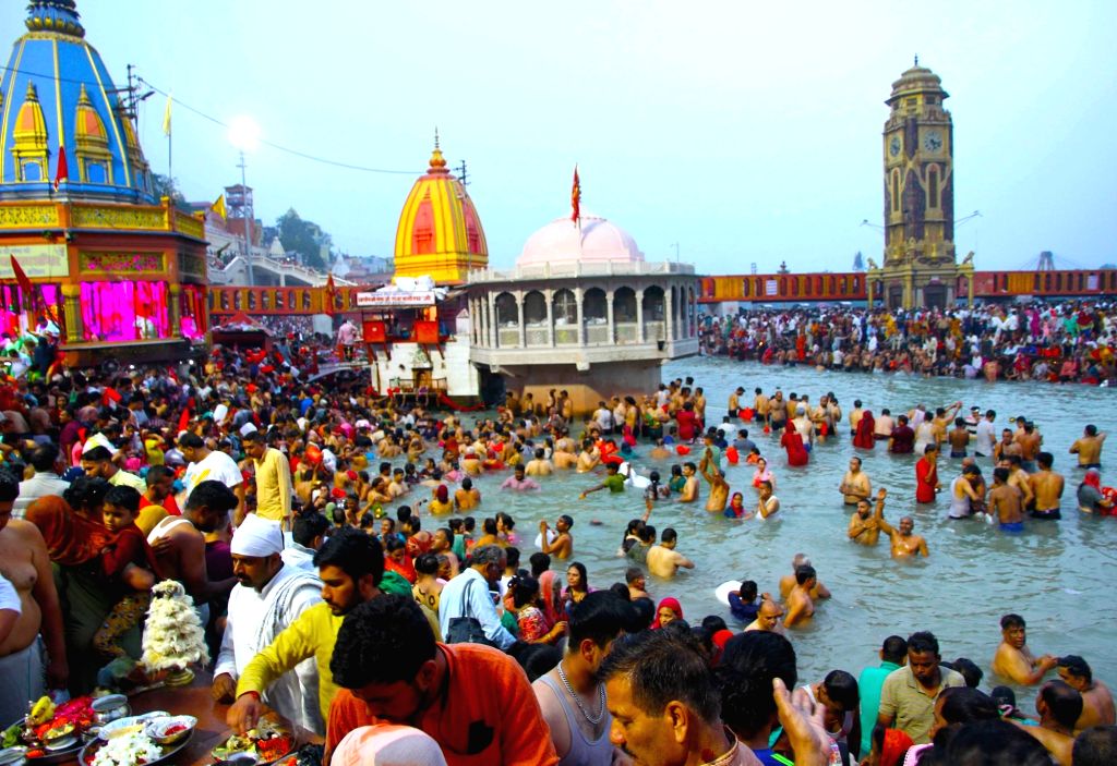 Hindu devotees in large numbers take holy dip in the river Ganga.