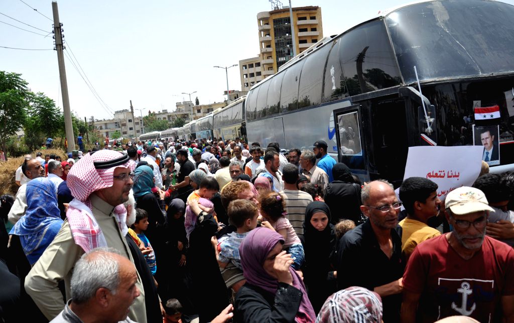 SYRIA-HOMS-PEOPLE-RETURN