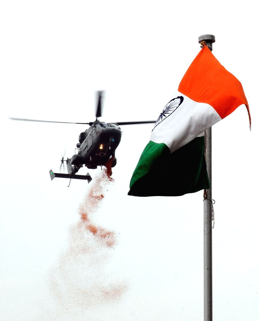 IAF’s MI-17 helicopters shower flower petals during the 77th ...