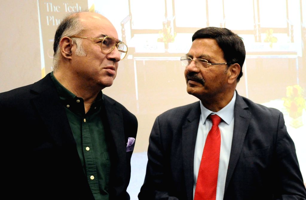 IANS Editor in Chief Sandeep Bamzai with the author T.N. Manoharan