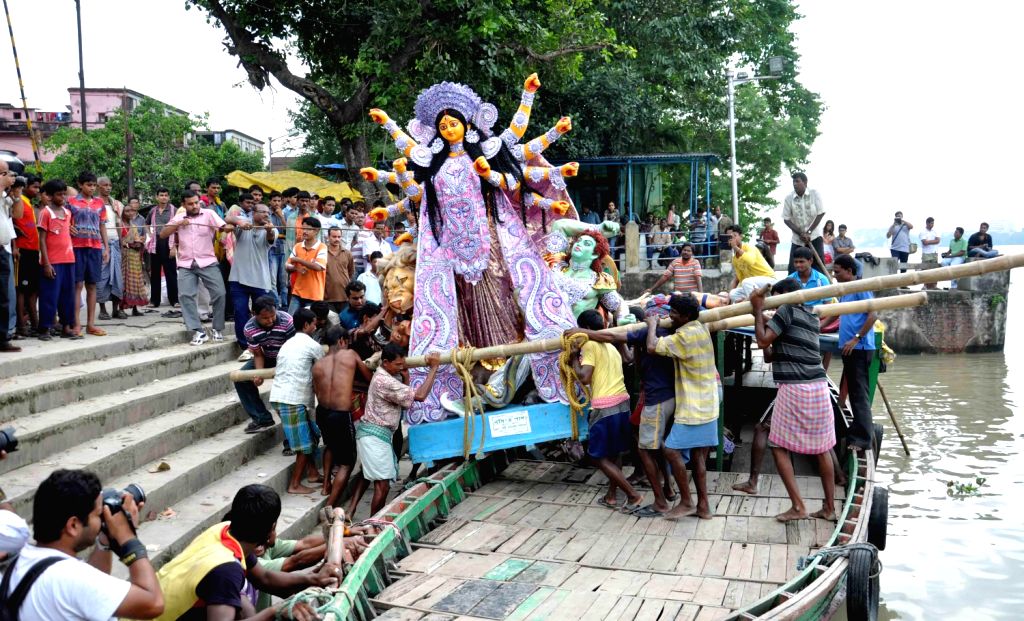 Durga Idol being transported on boats