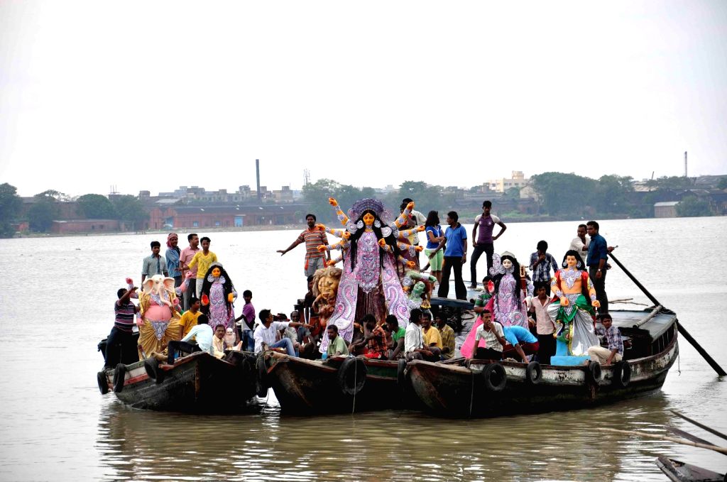 Durga Idol being transported on boats