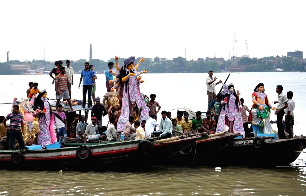 Durga Idol being transported on boats