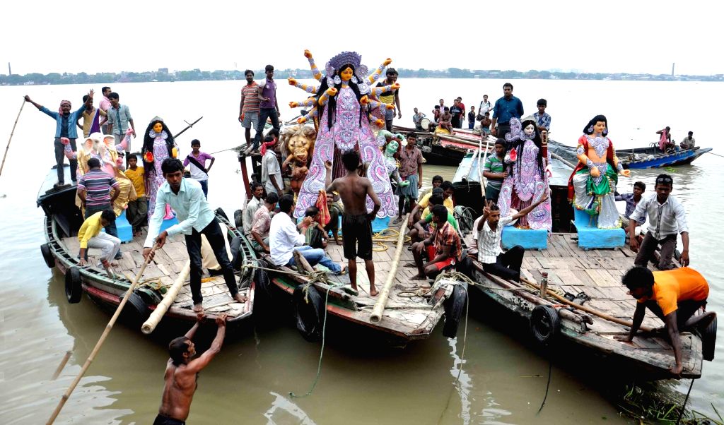 Durga Idol being transported on boats
