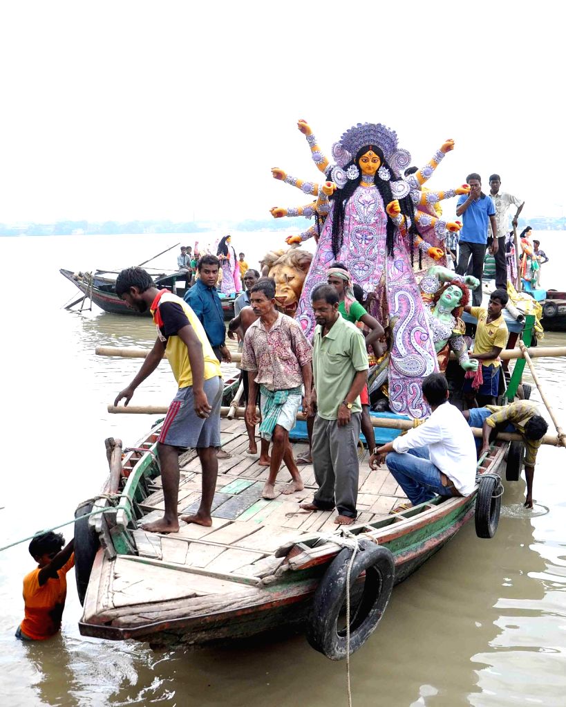 Durga Idol being transported on boats