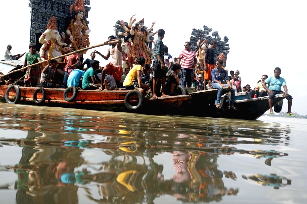 Durga idols being carried to pandals