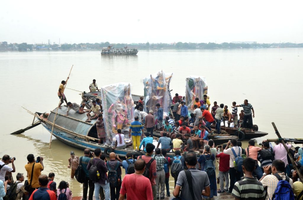 Goddess Durga idols transported on boats through Ganga river