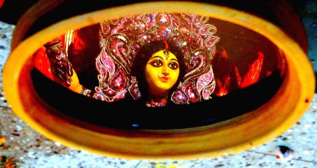 Goddess Durga being immersed in the waters of mighty Brahmaputra