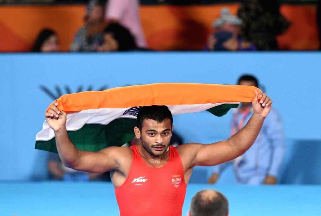 India's Deepak Punia hold Indian flag after winning against Pakistan's ...