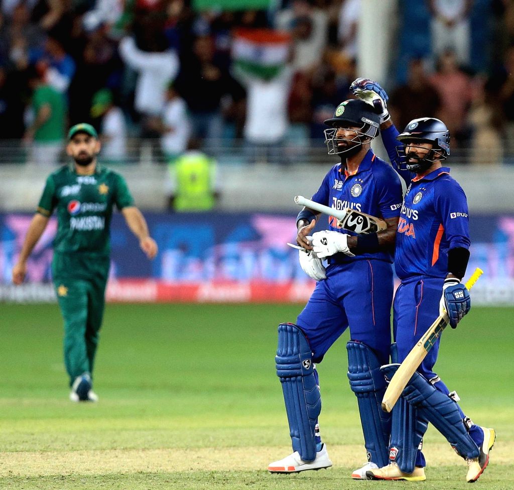 :Dubai:India's Hardik Pandya, is congratulated by batting partner ...