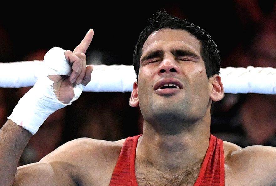 India's Mohammad Hussamuddin reacts after winning Men's Quarter Final ...
