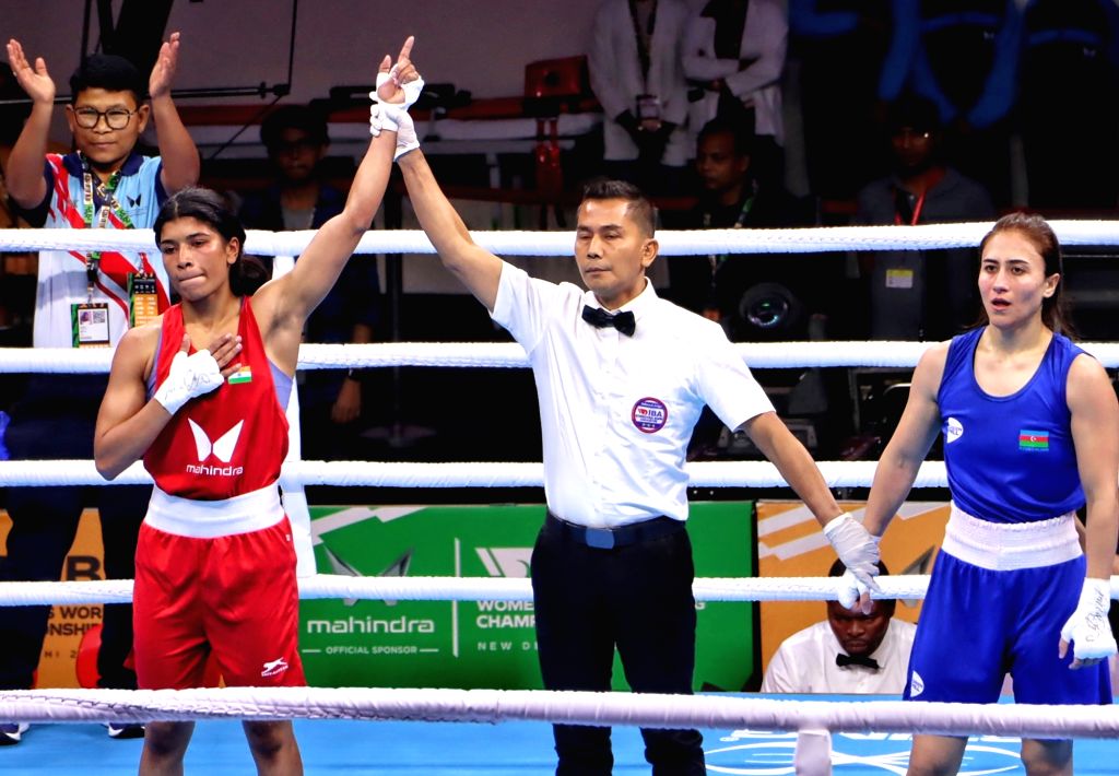 India's Nikhat Zareen (red) being declared winner