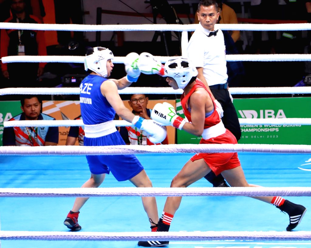 India's Nikhat Zareen (red) in an action with Azerbaijan's Anakhanim ...