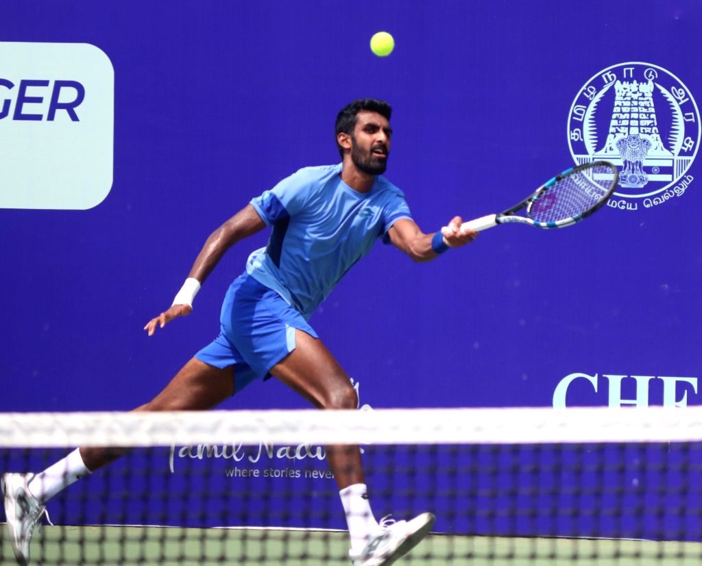 Prajnesh Gunneswaran plays a shot against British tennis player Jay Clarke.