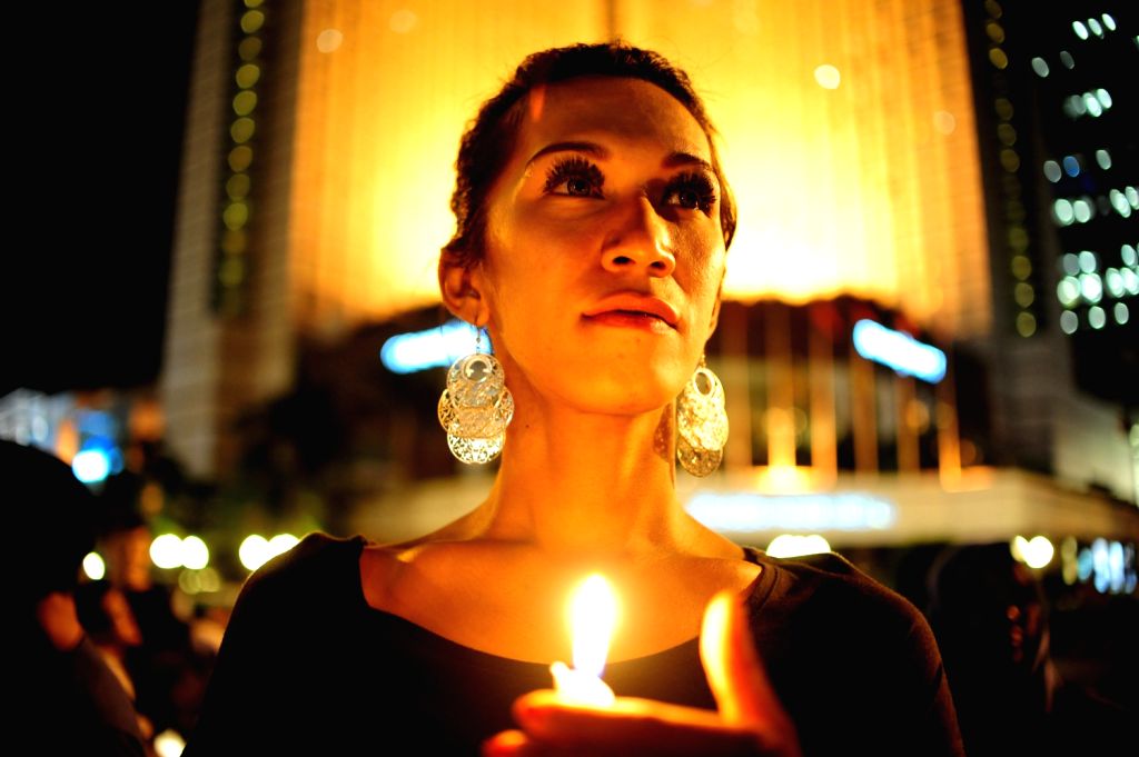 Indonesian transgenders take part in a candlelight vigil in Jakarta