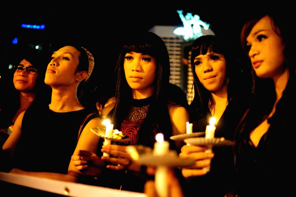 Indonesian transgenders take part in a candlelight vigil in Jakarta