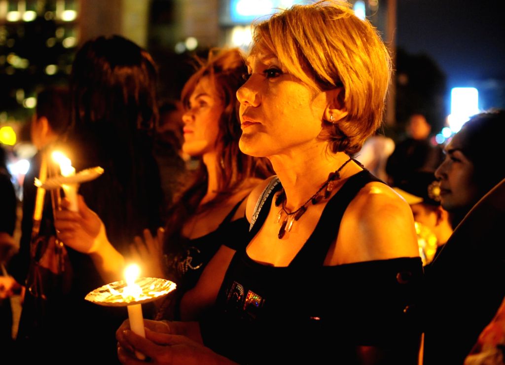 Indonesian transgenders take part in a candlelight vigil in Jakarta