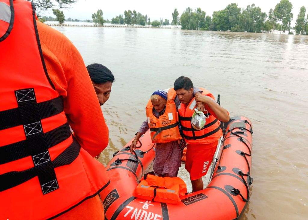 NDRF teams carry out rescue and evacuation operations in flood-affected ...