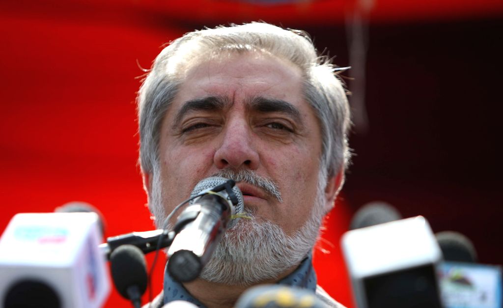 Supporters of Afghan presidential candidate Abdullah Abdullah take part ...