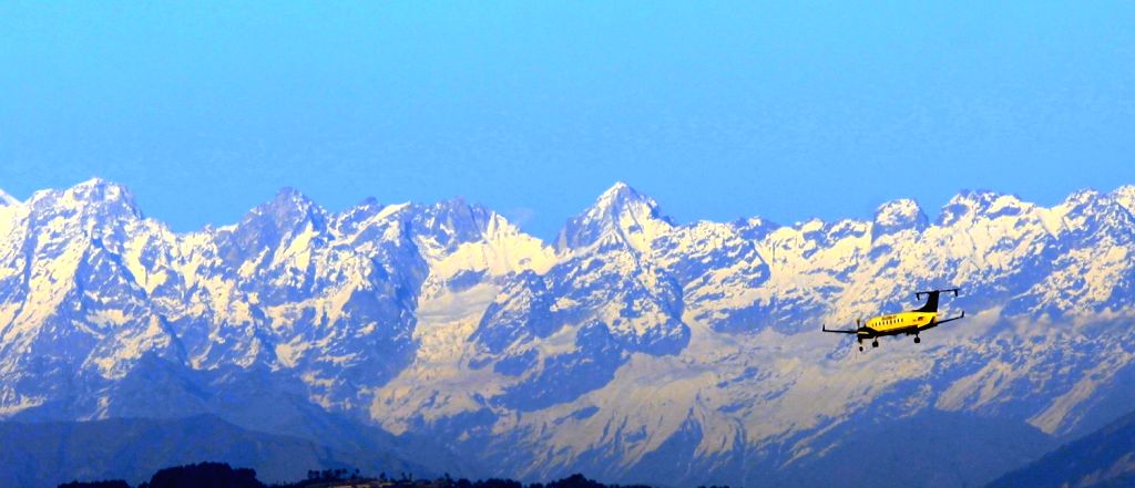 A domestic plane on the background of mesmerizing Himalayan Range