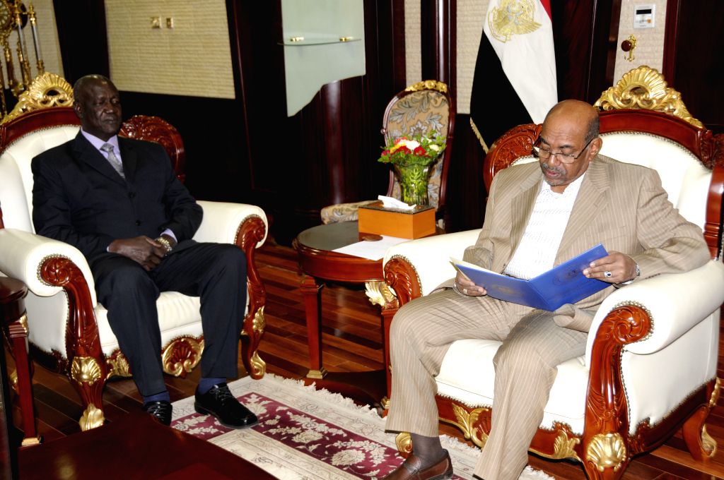 President Omar al-Bashir reads a letter delivered by South Sudan's ...
