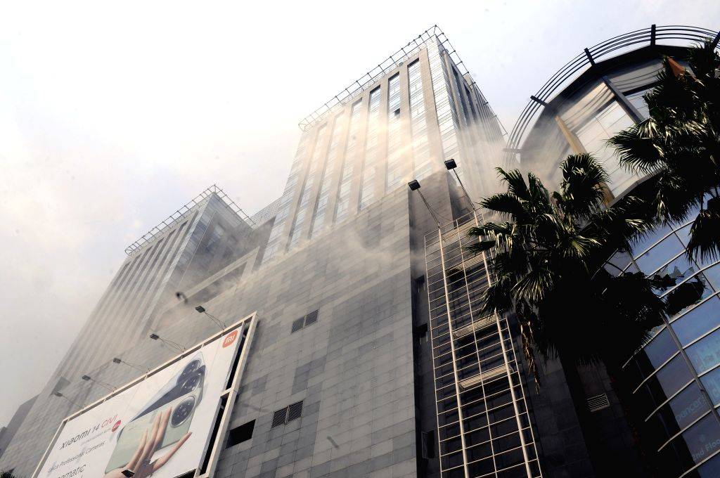 Kolkata : Firefighters try to douse a fire after it breaks out at a ...