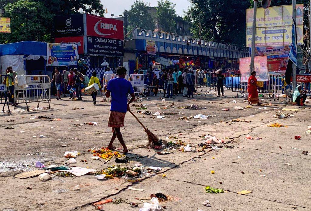 Kolkata Municipal Corporation (KMC) workers clean up Nimtala Ganga ghat ...