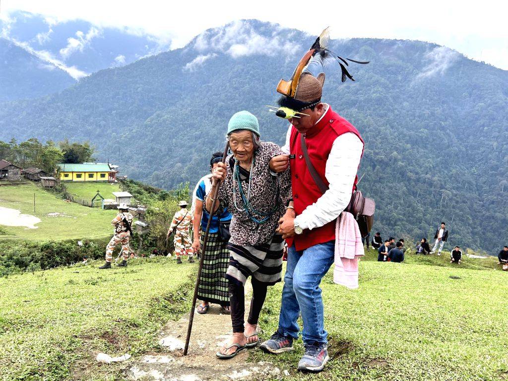 Kurung Kumey: An elderly voter being escorted during the first phase of ...
