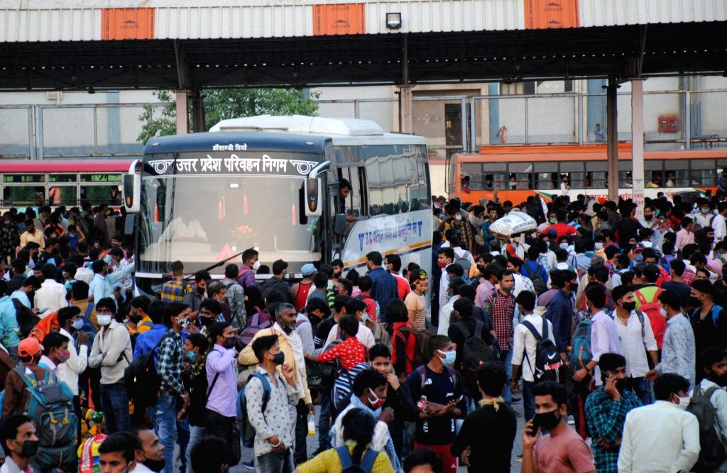 Large numbers of migrants at Kaushambi bus stand to board buses for ...
