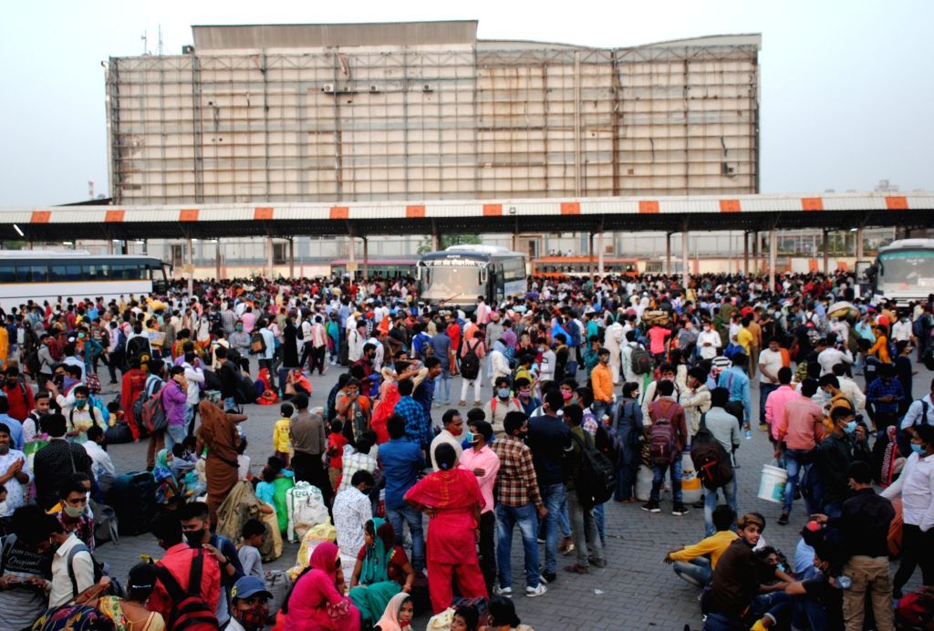 Large numbers of migrants at Kaushambi bus stand to board buses for ...