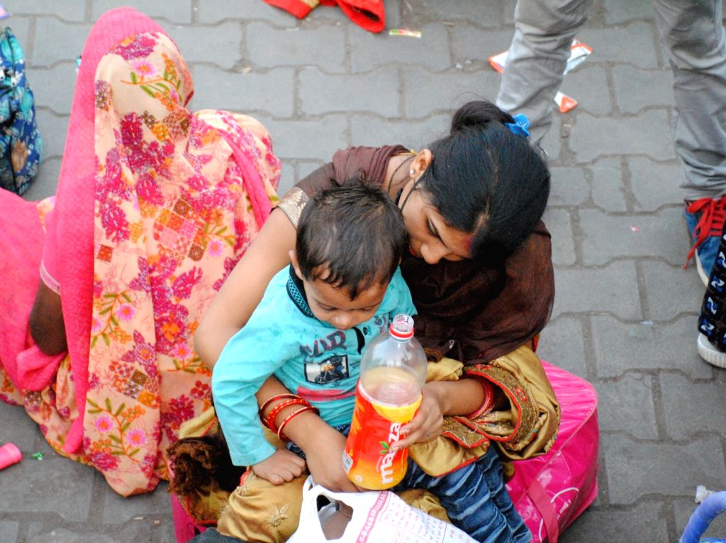 Large numbers of migrants at Kaushambi bus stand to board buses for ...