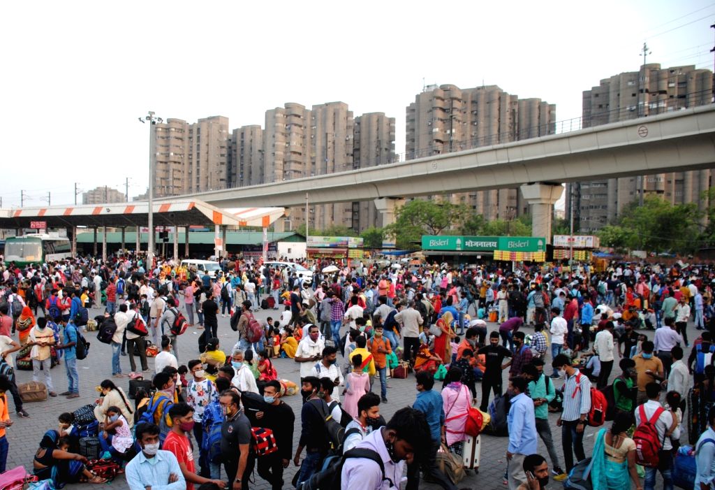 Large numbers of migrants at Kaushambi bus stand to board buses for ...