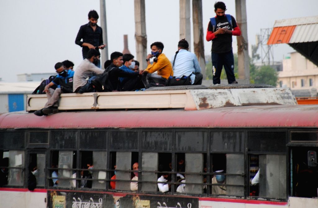 Large numbers of migrants at Kaushambi bus stand to board buses for ...