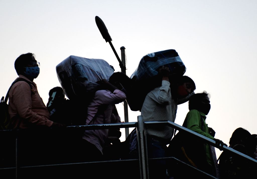 Large numbers of migrants at Kaushambi bus stand to board buses for ...
