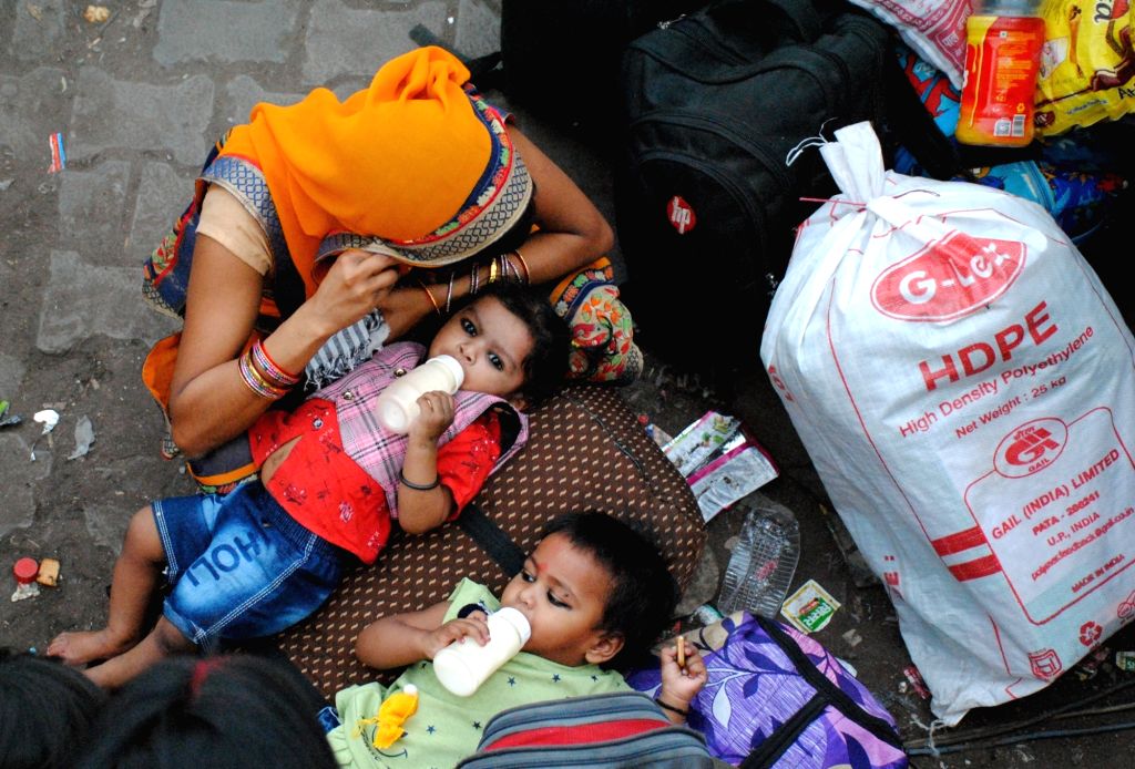 Large numbers of migrants at Kaushambi bus stand to board buses for ...