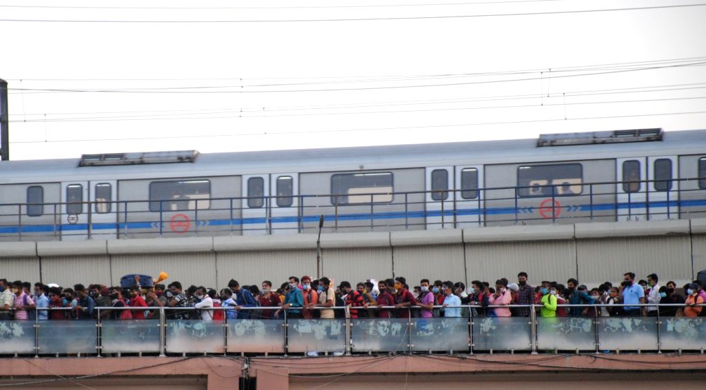 Large numbers of migrants at Kaushambi bus stand to board buses for ...