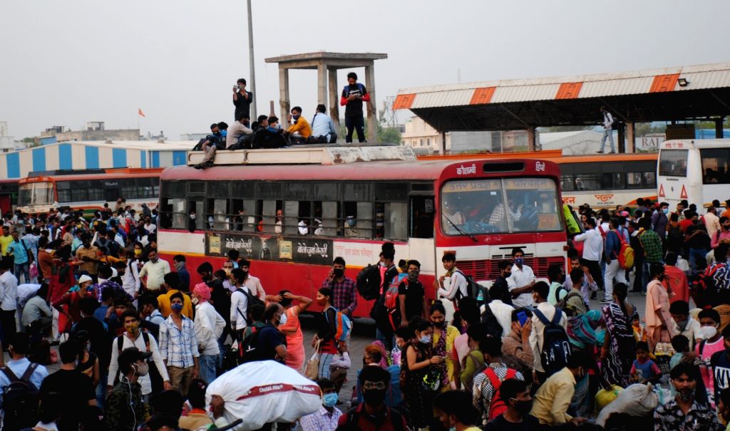Large numbers of migrants at Kaushambi bus stand to board buses for ...