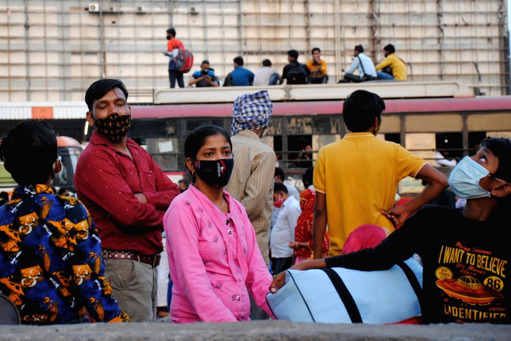 Large numbers of migrants at Kaushambi bus stand to board buses for ...