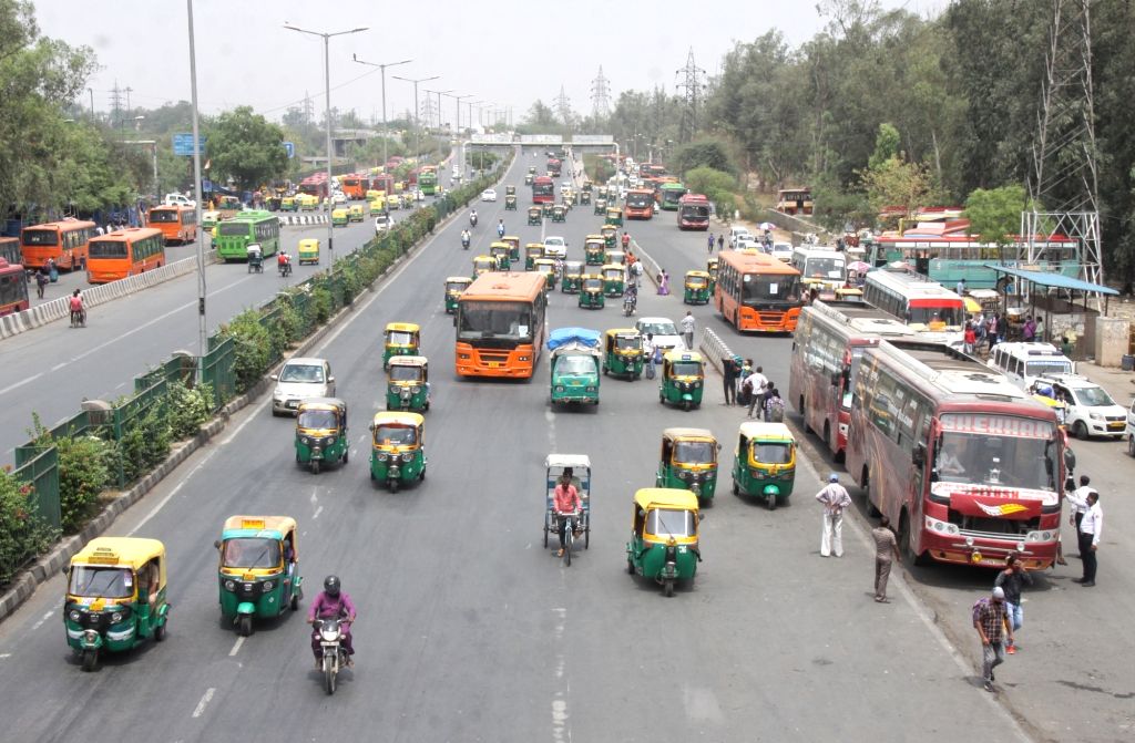 : Large numbers of migrants at Kaushambi bus stand to board buses for ...