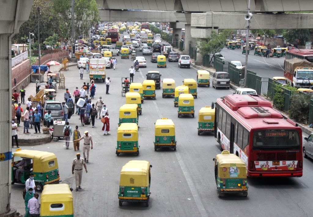 : Large numbers of migrants at Kaushambi bus stand to board buses for ...