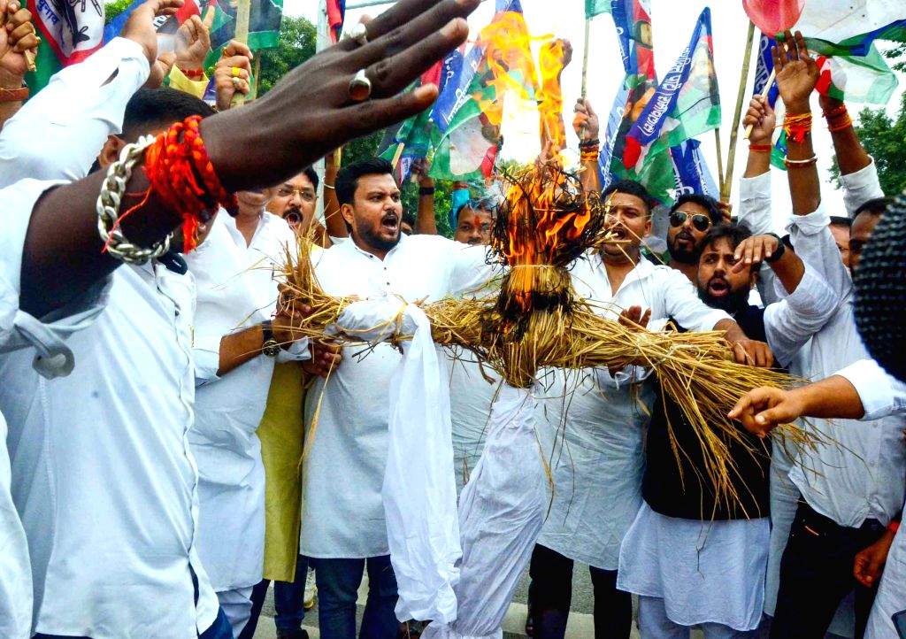 Lok Janshakti Party (Ram Vilas) workers burn an effigy of WB CM Mamata ...