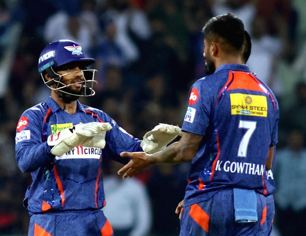 Lucknow : LSG bowler Krishnappa Gowtham with teammate Nicholas Pooran ...