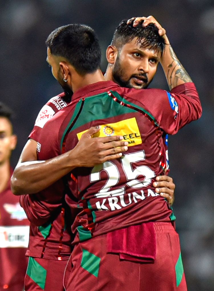 LSG's bowler Krishnappa Gowtham with team captain Krunal Pandya ...
