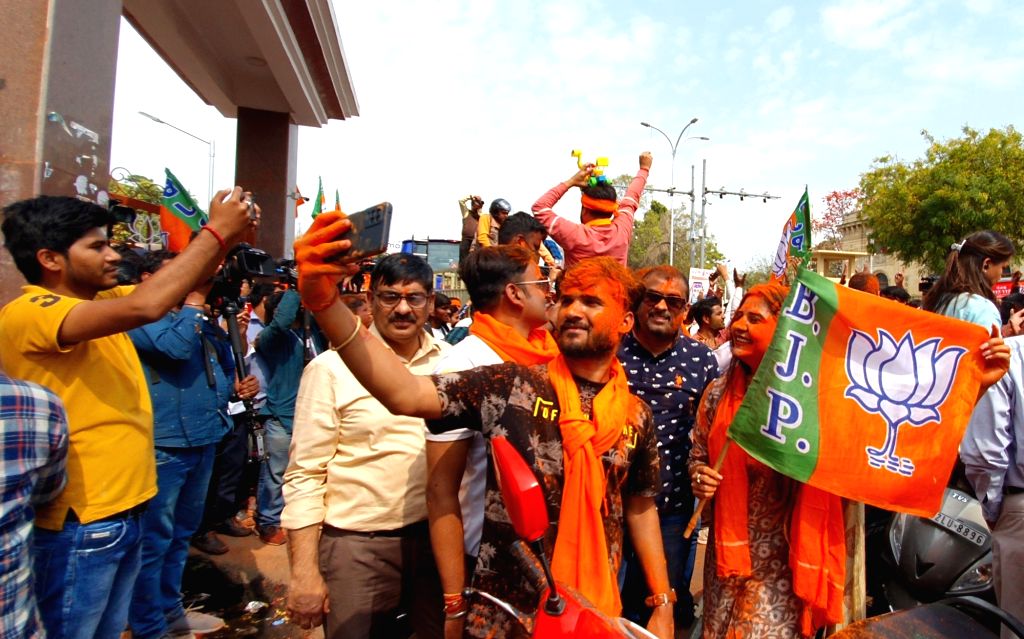 : Lucknow :Bharatiya Janata Party (BJP) workers celebrate with color ...
