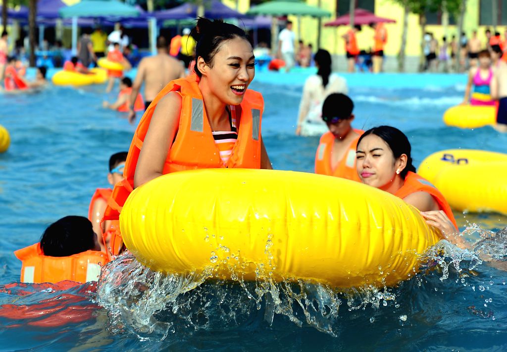 People have fun at a water park in Luoyang, central China's Hunan Province