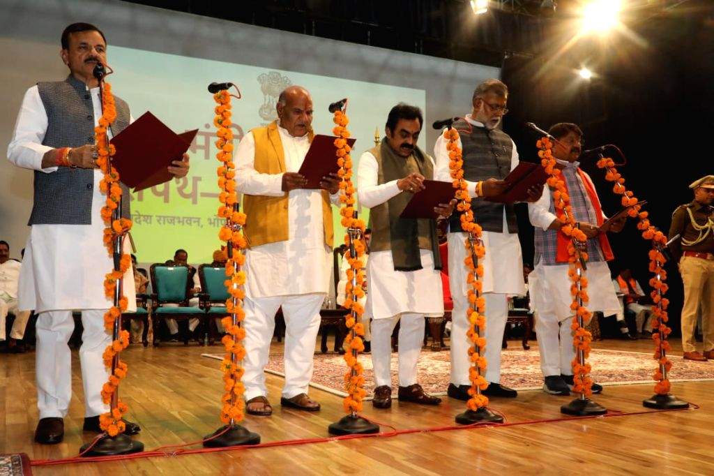 Madhya Pradesh Governor Mangubhai Patel administers the oath of the ...