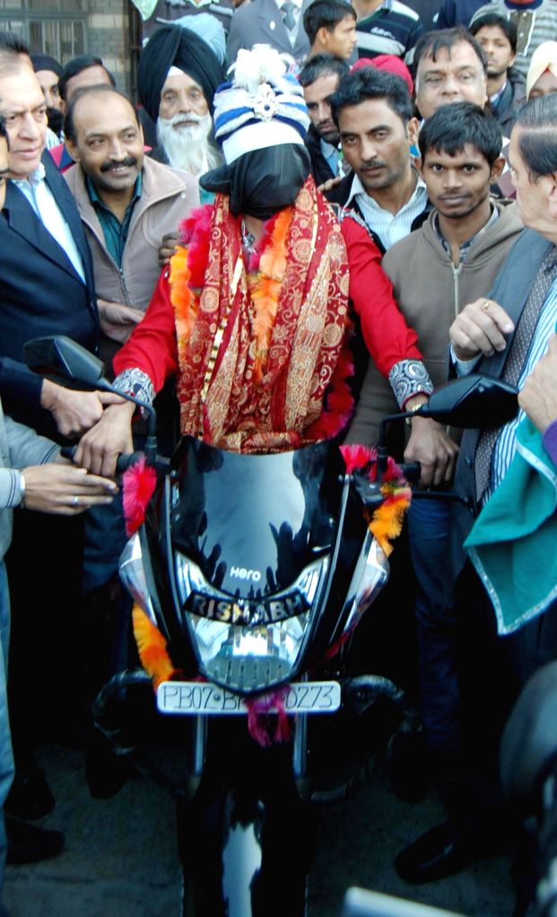 Magician Samrat Shankar rides a motor cycle blindfolded