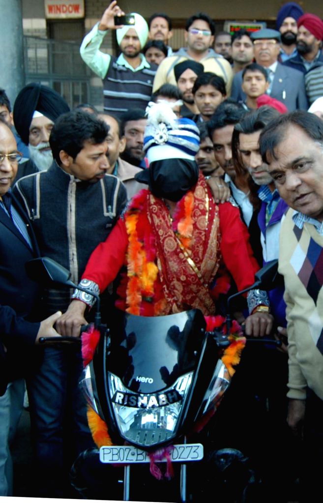 Magician Samrat Shankar rides a motor cycle blindfolded