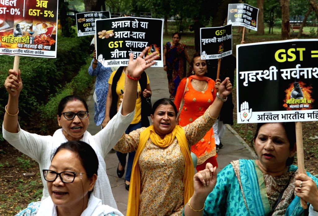 Mahila Congress members stage a protest against inflation and GST hike