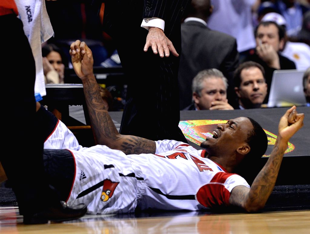 NCAA Basketball 2013 - Louisville Player Kevin Ware Breaks Leg